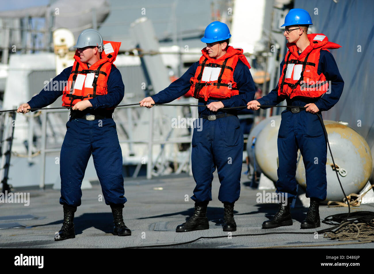 Sailors maintain a sound-powered phone line during operations in the ...