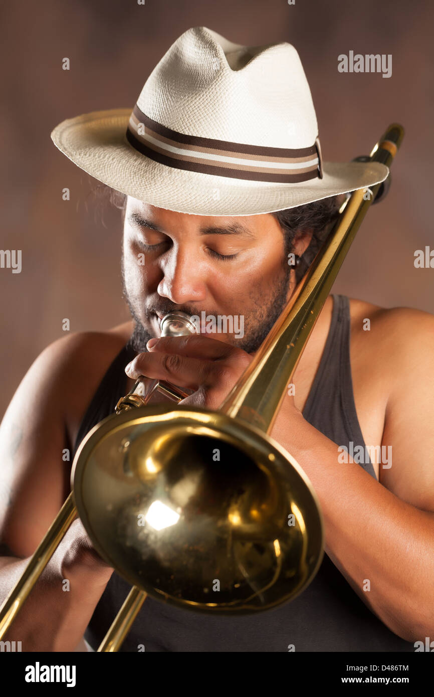 Rastafarian Man Play Trombone Wearing A Panama Hat Stock Photo - Alamy