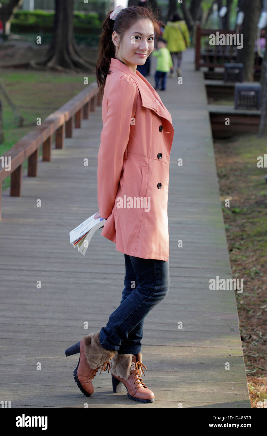 Girl student walks in in university campus with book Stock Photo - Alamy Girl student walks in in university campus with book Stock Photo - Alamy