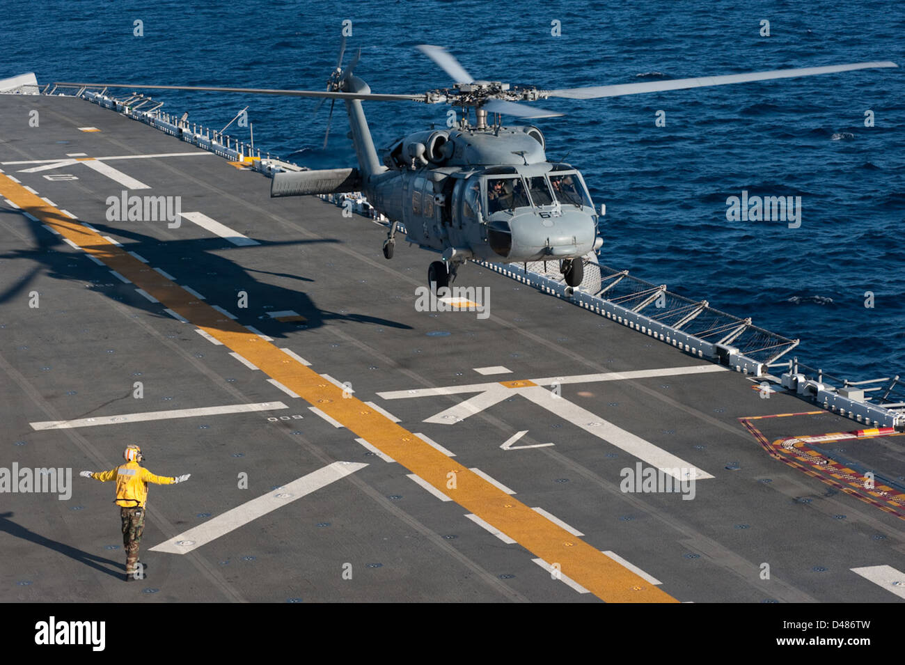 An MH-60S helicopter lands aboard USS Boxer Stock Photo - Alamy