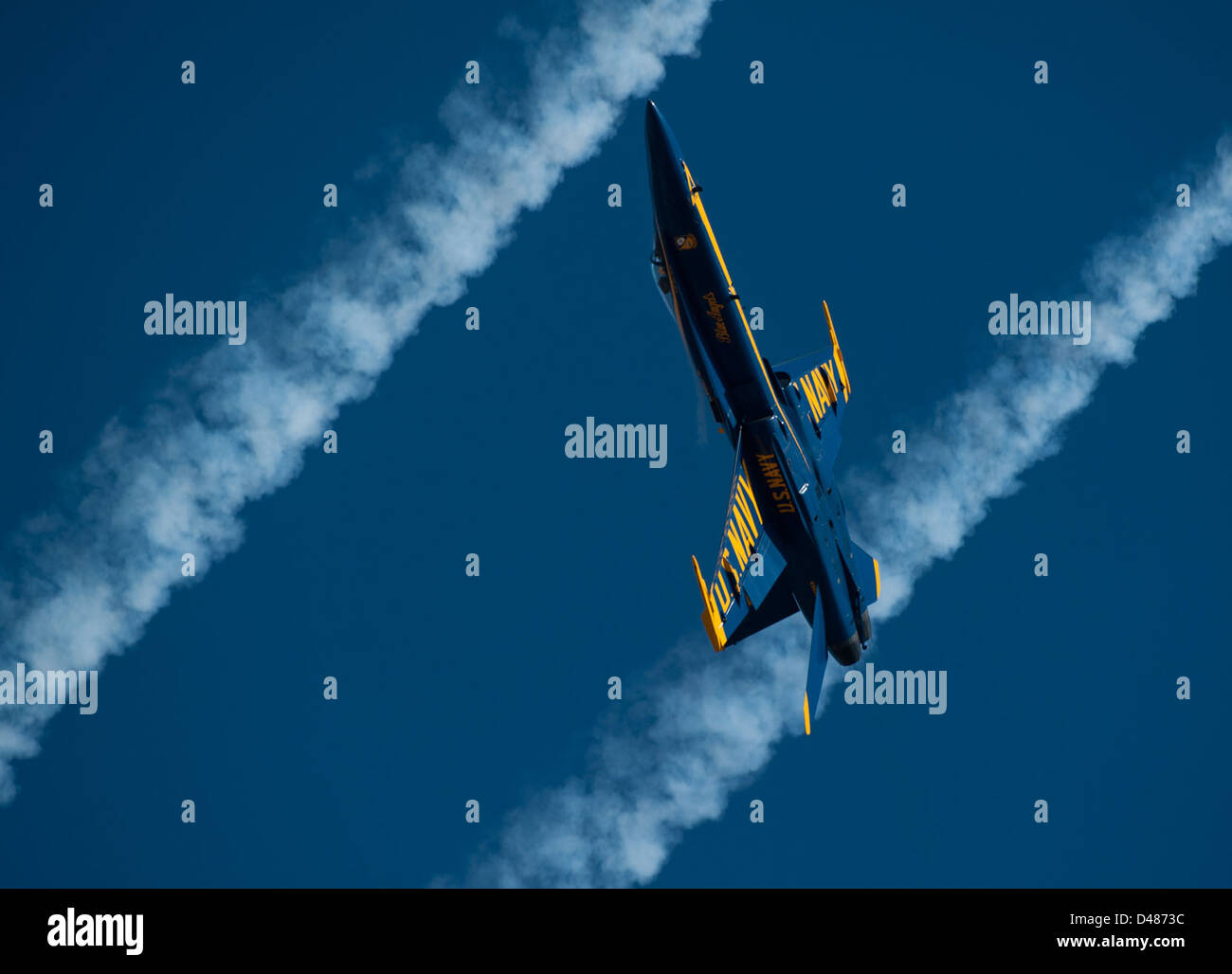 An F/A-18 Hornet from the Blue Angels performs an aerobatic ...