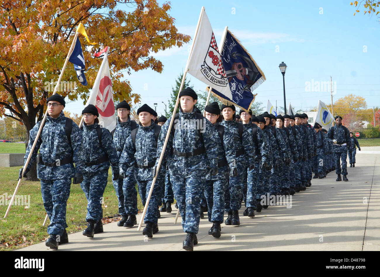 Navy recruits march during basic training at Great Lakes, Illinois, as ...