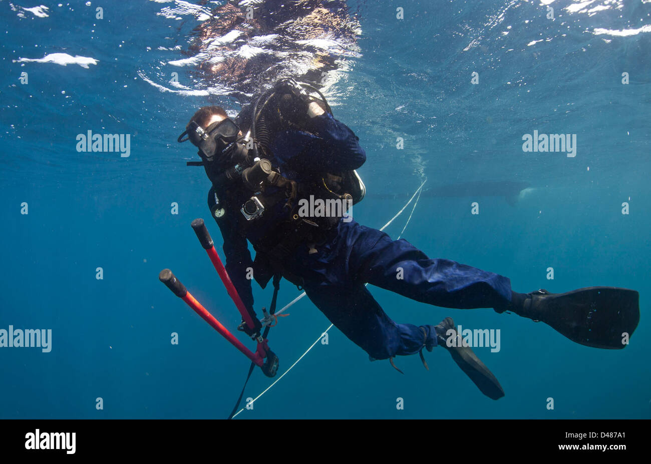 A Navy diver swings underwater Stock Photo - Alamy