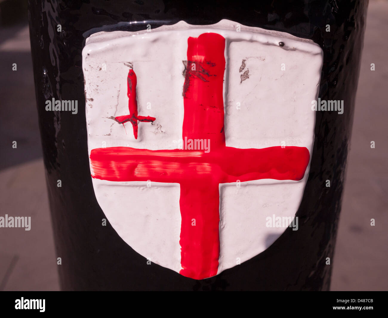 The City of London crest and emblem displayed on a bollard marking the ...