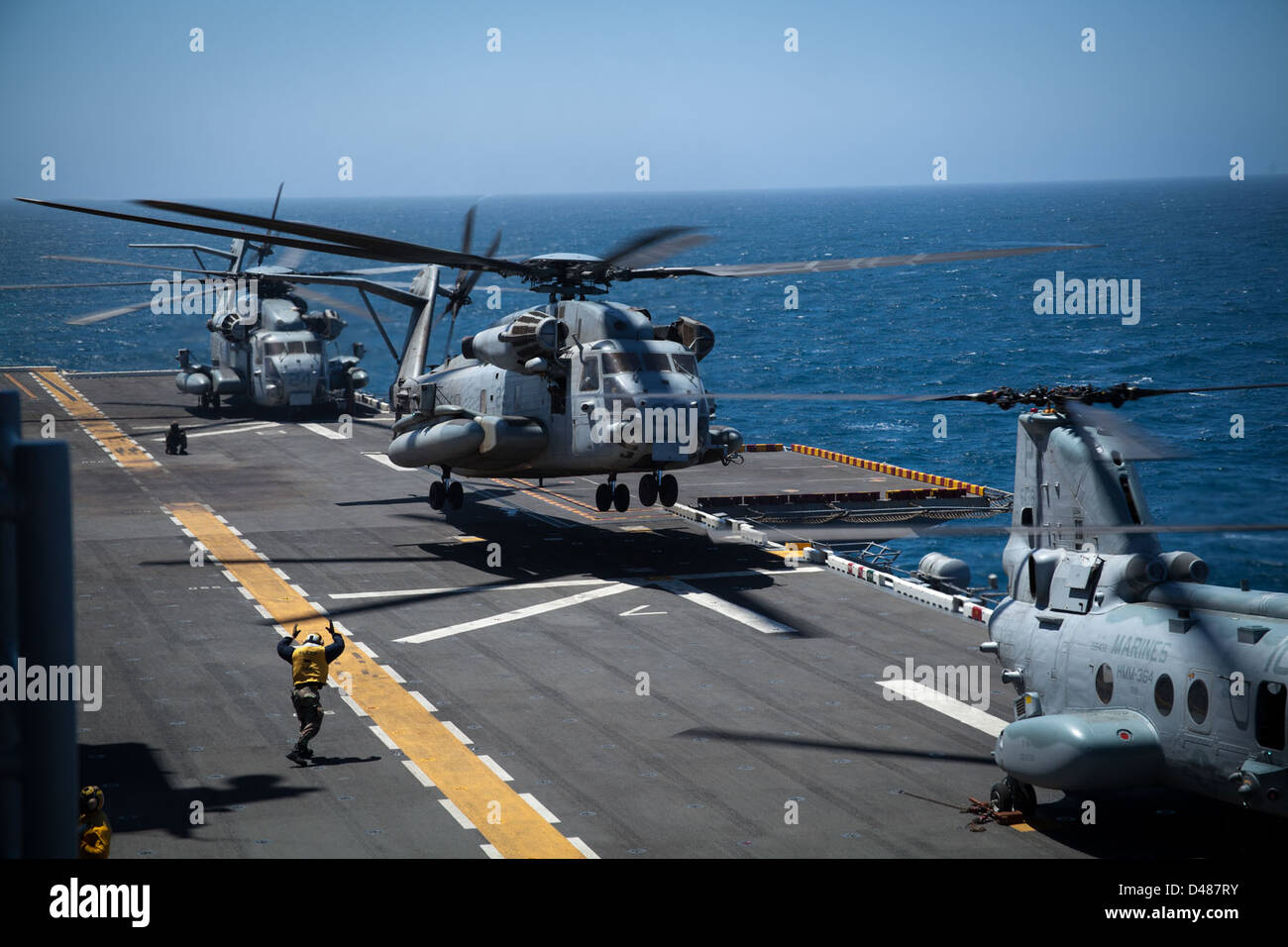 A CH-53E Super Stallion helicopter lifts off from a U.S. Navy ship in ...