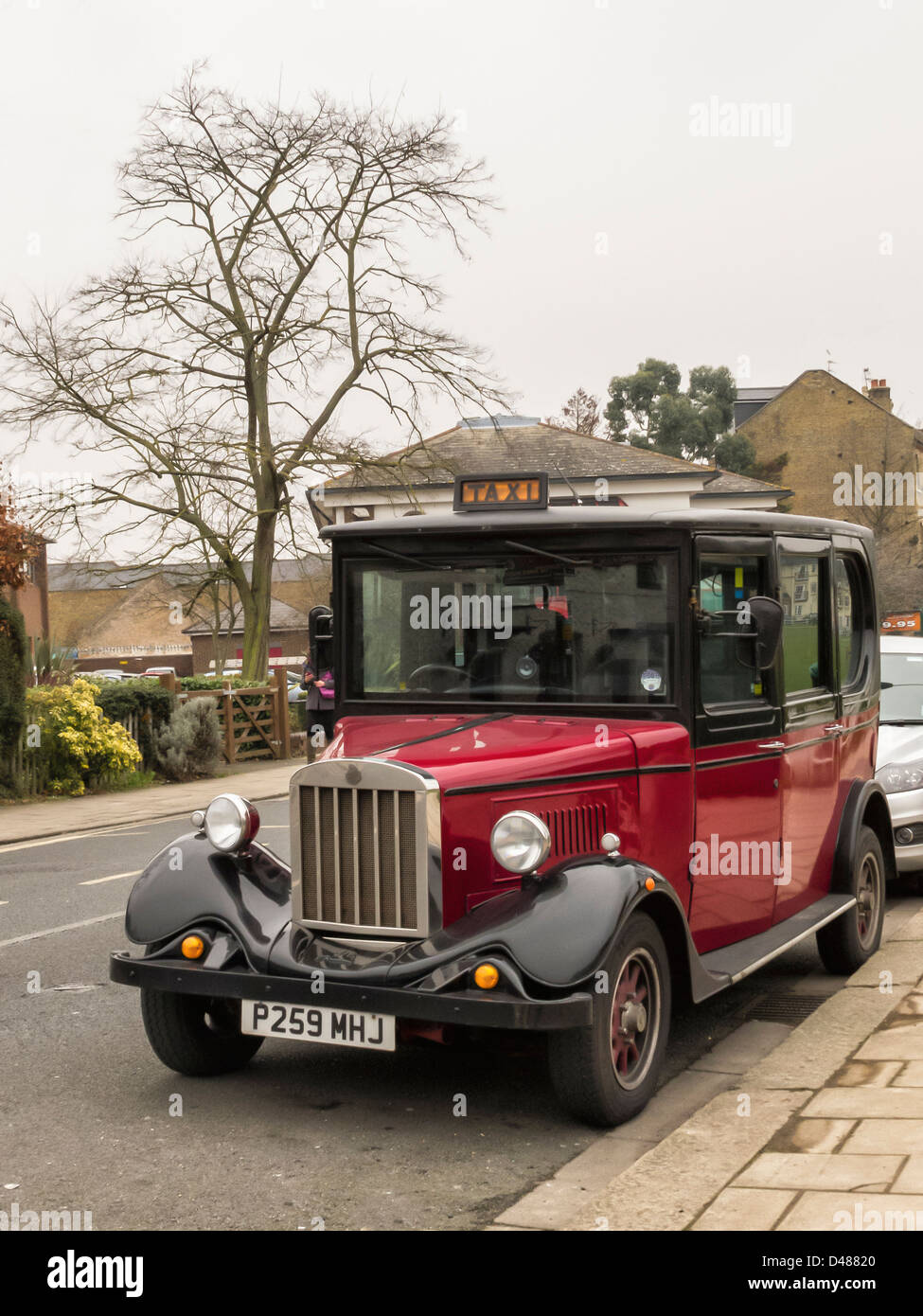 Vintage red taxi cab parked - Twickenham Stock Photo - Alamy