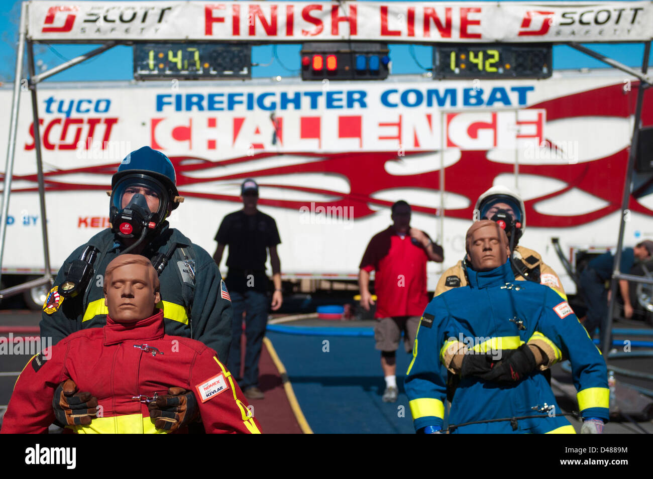 A Sailor participates in a safety challenge by pulling a dummy ...