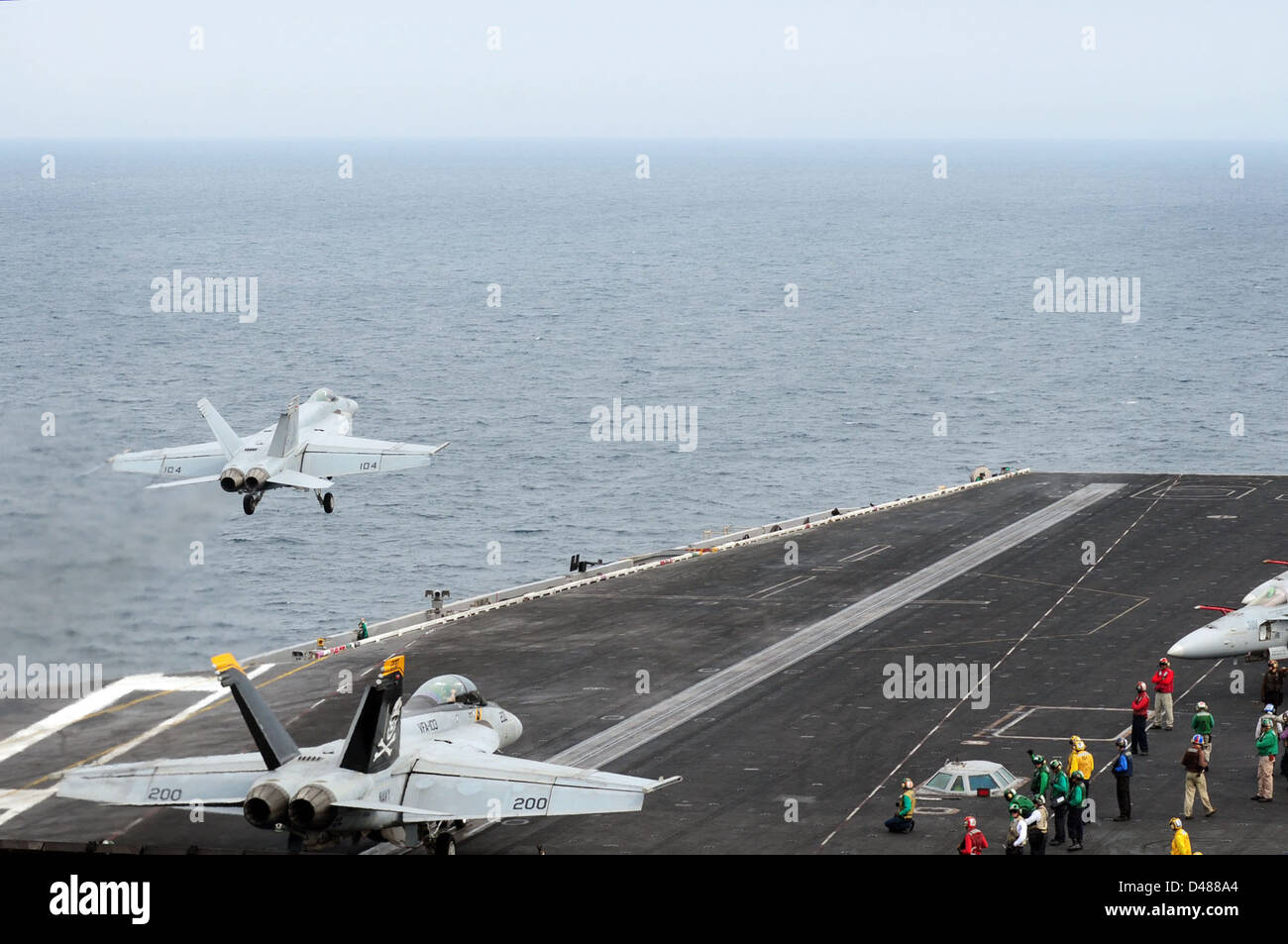 An F/A-18E Super Hornet launches from a U.S. Navy aircraft carrier in ...