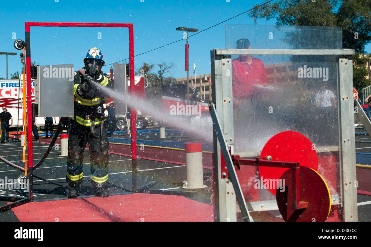 A firefighter participates in a safety challenge Stock Photo - Alamy