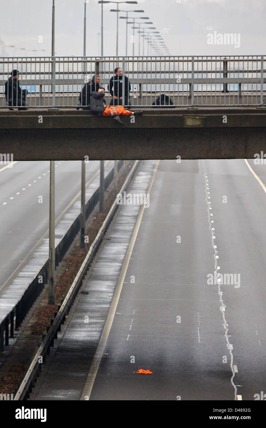 Police deal with a man who had climbed onto a bridge over the M40 ...