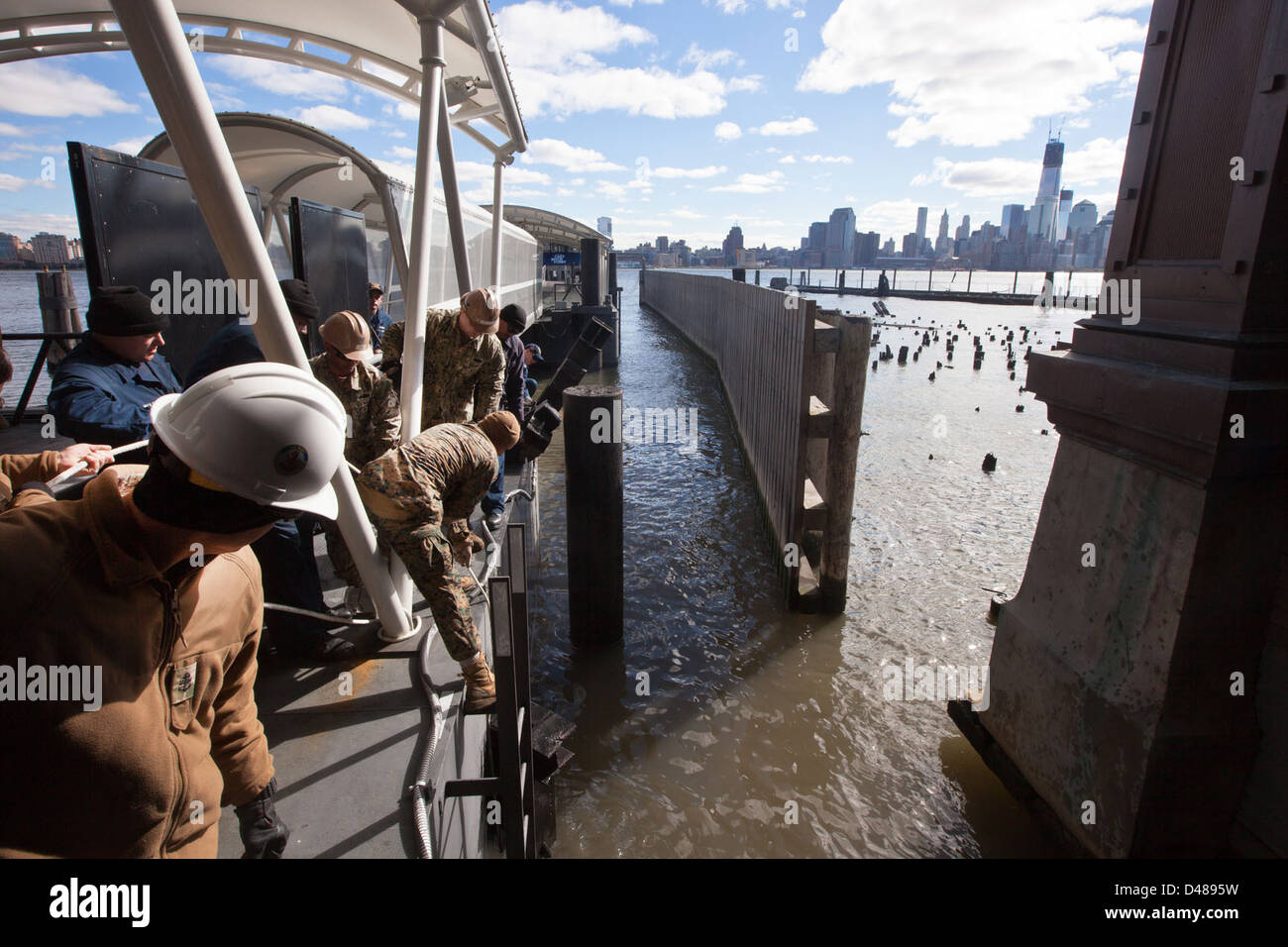 Seabees repair pier facilities in Hoboken, New Jersey, following damage ...