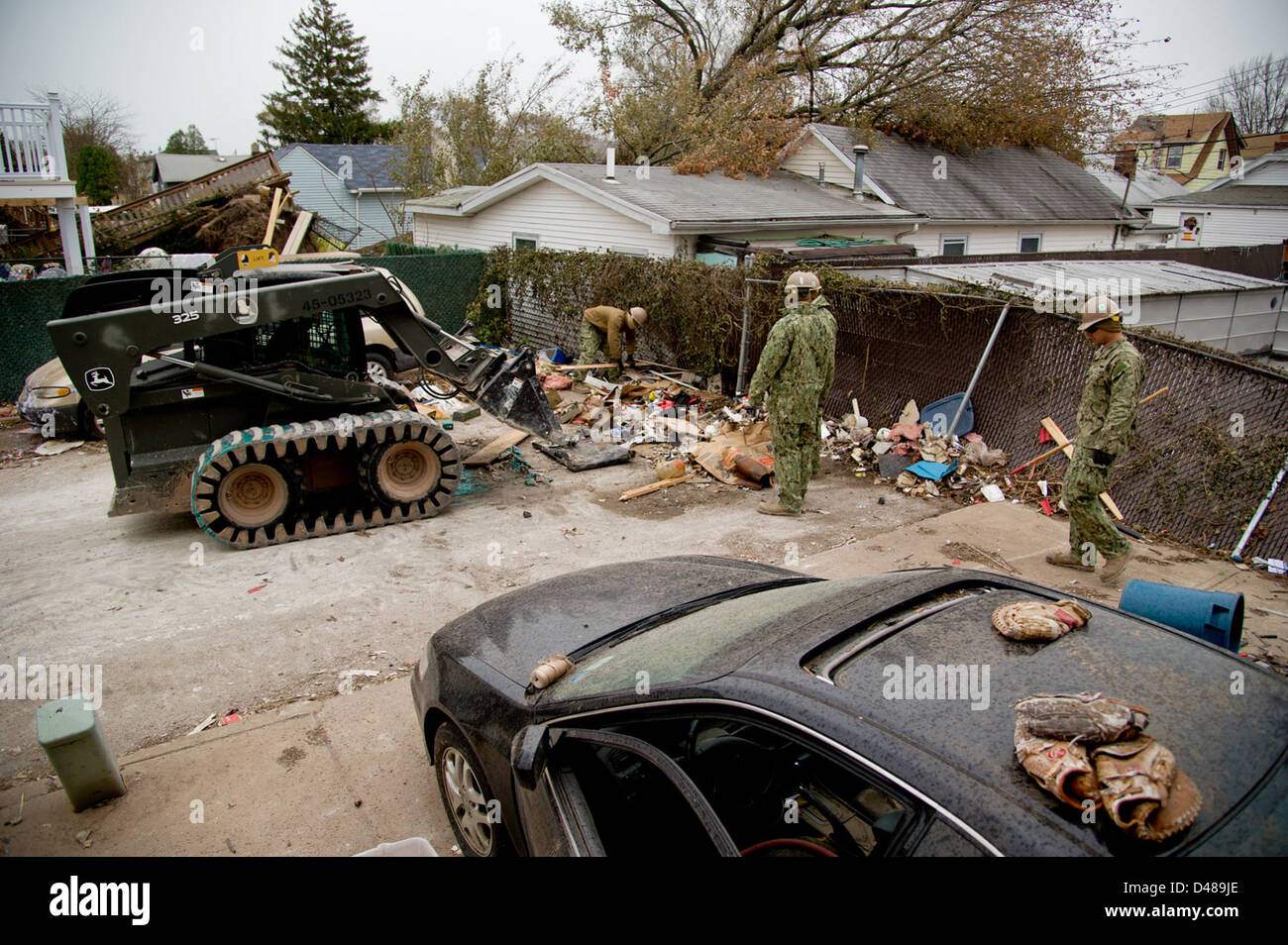 U.S. Navy sailors assist in the cleanup efforts following Hurricane ...