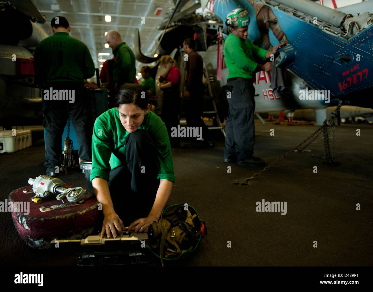 A Sailor reviews a computerized technical manual Stock Photo - Alamy