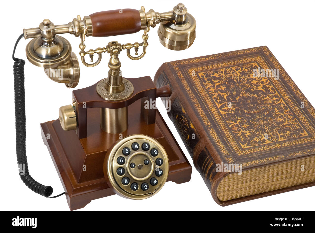 Ancient phone and book are photographed on the white background Stock ...