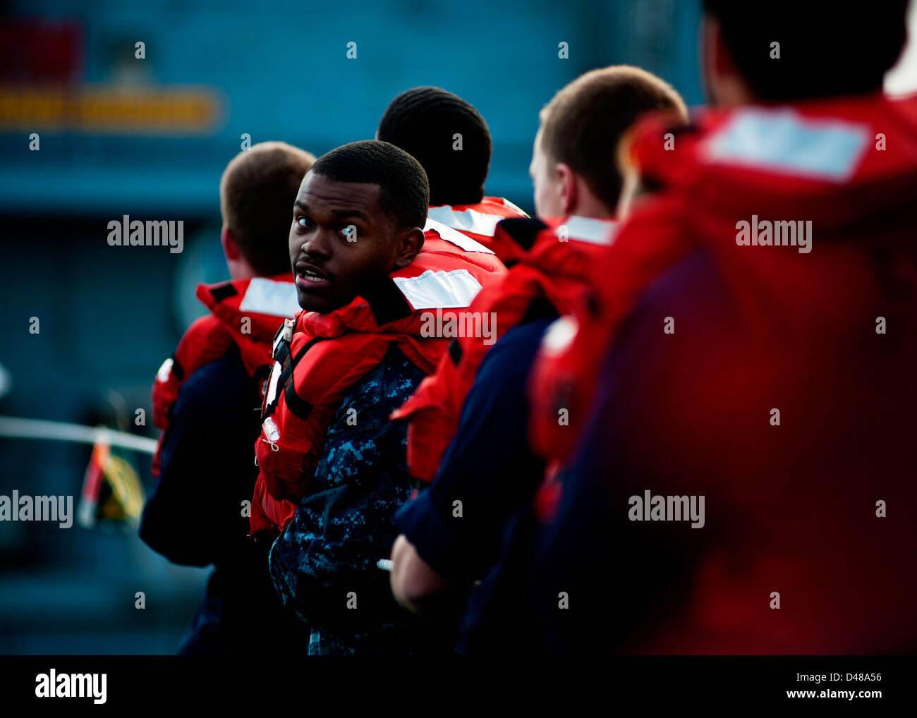 Sailors handle a phone-and-distance line Stock Photo - Alamy