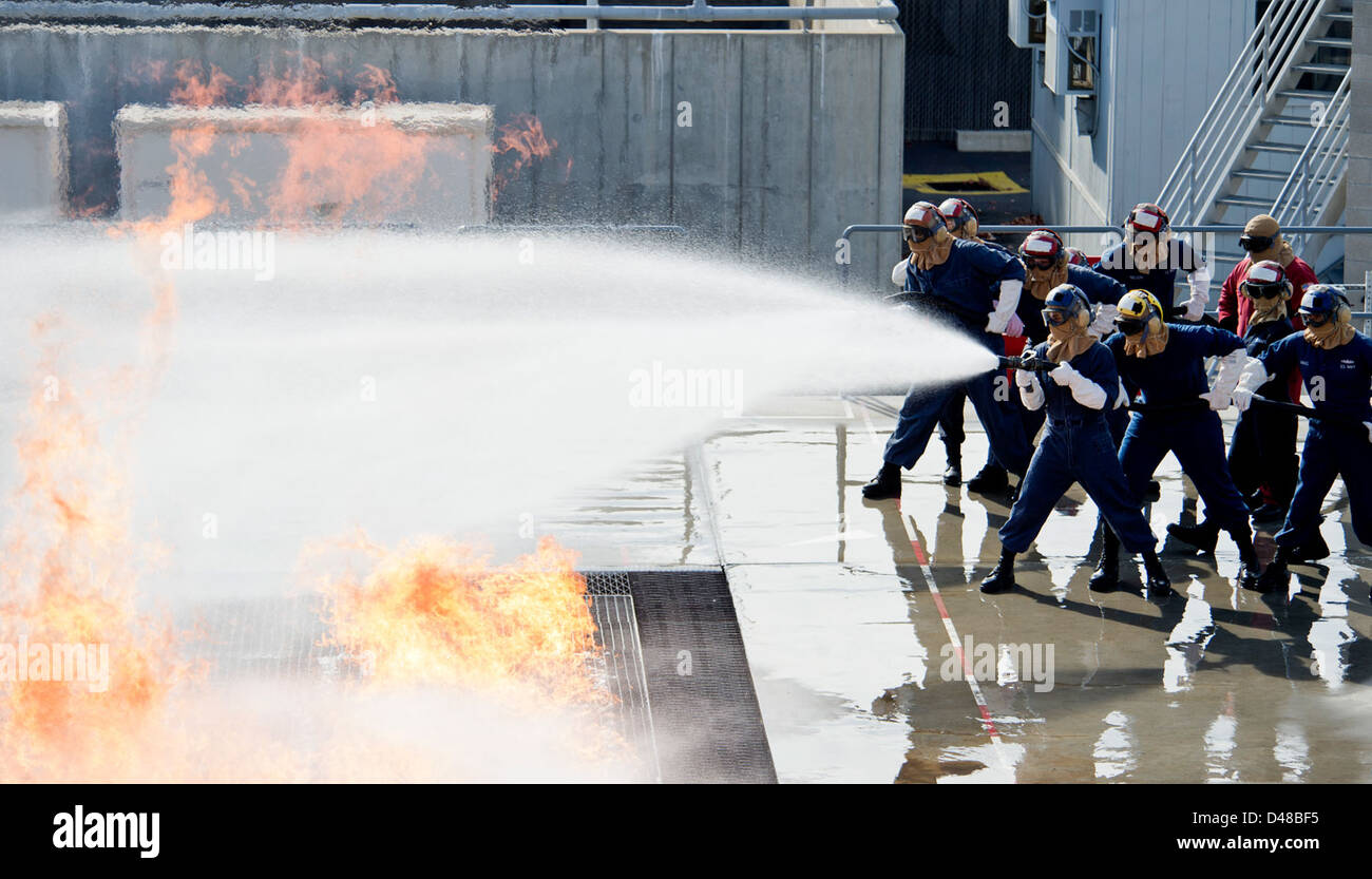Sailors aboard a U.S. Navy ship at Naval Base San Diego conduct fire ...