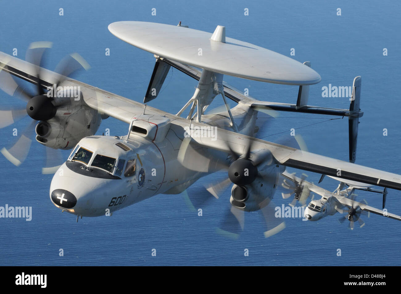 An E-2C Hawkeye early warning aircraft conducts operations over ...