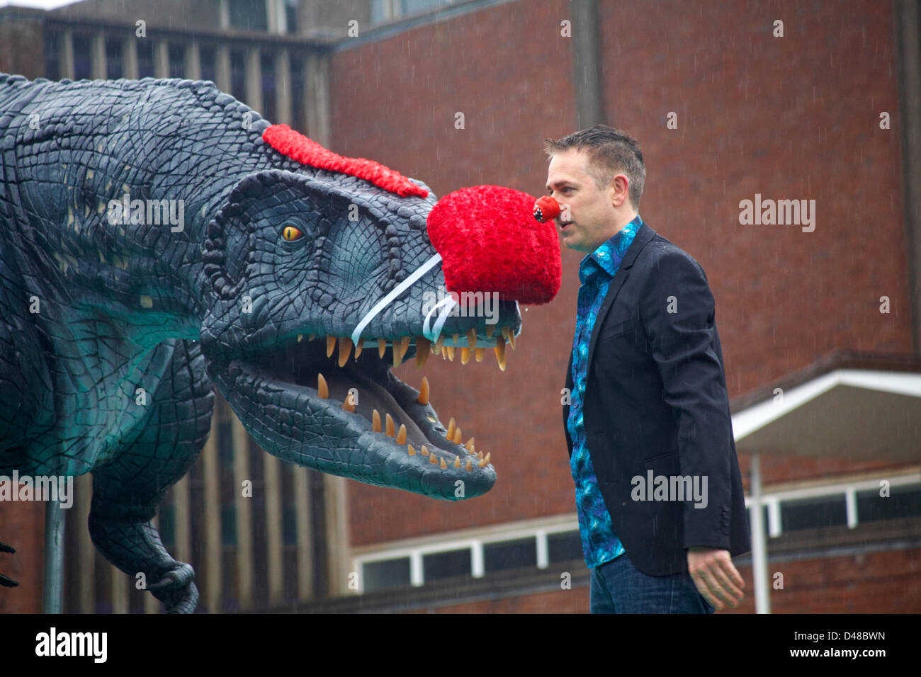 Man with head in dinosaur hi-res stock photography and images - Alamy