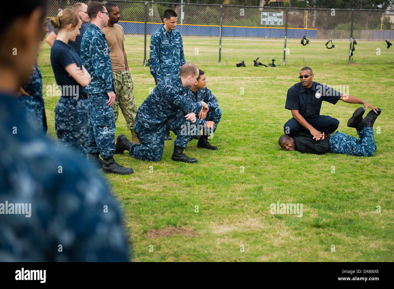 A police instructor teaches takedown techniques Stock Photo - Alamy