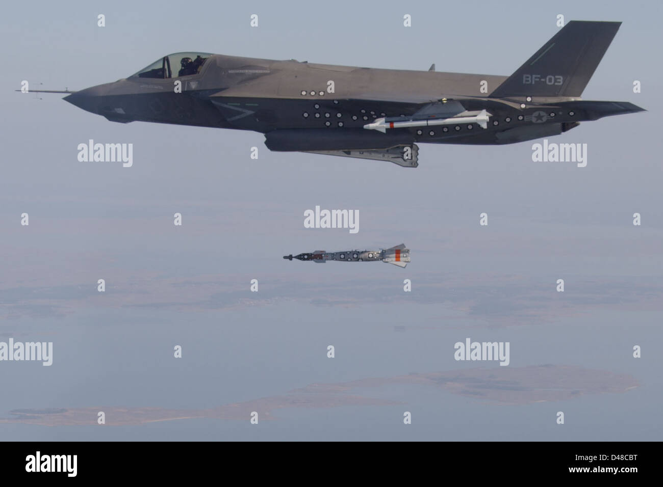 An F-35B Joint Strike Fighter conducts a test bomb drop during an ...