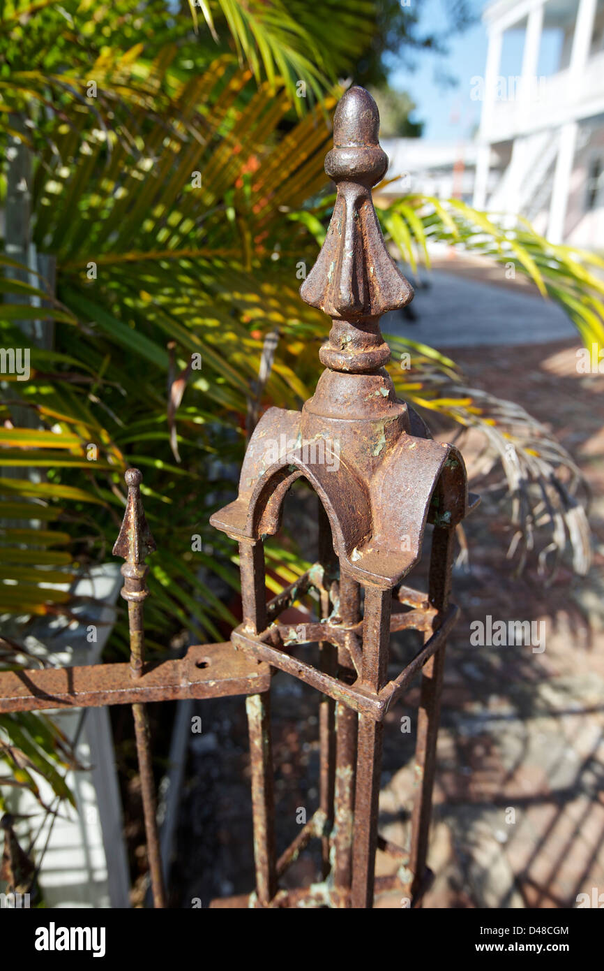 Rusty ornate metal fence post in Key West Stock Photo - Alamy