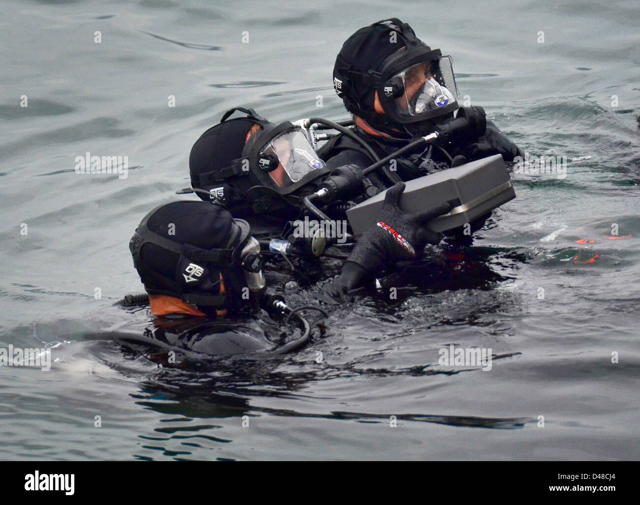 Divers place the remains of a fallen USS Arizona Sailor at their final ...