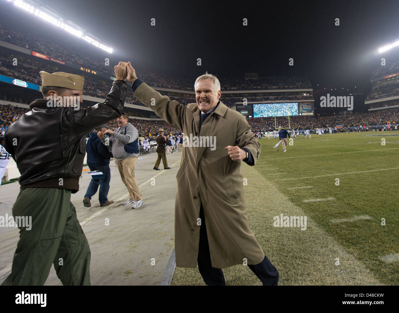 Secretary of the Navy Ray Mabus shares a high-five with a U.S. Navy ...