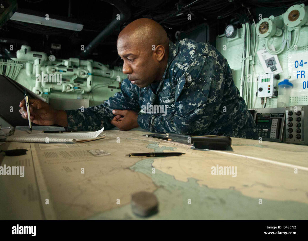 A Sailor plots a course for USS New York Stock Photo - Alamy
