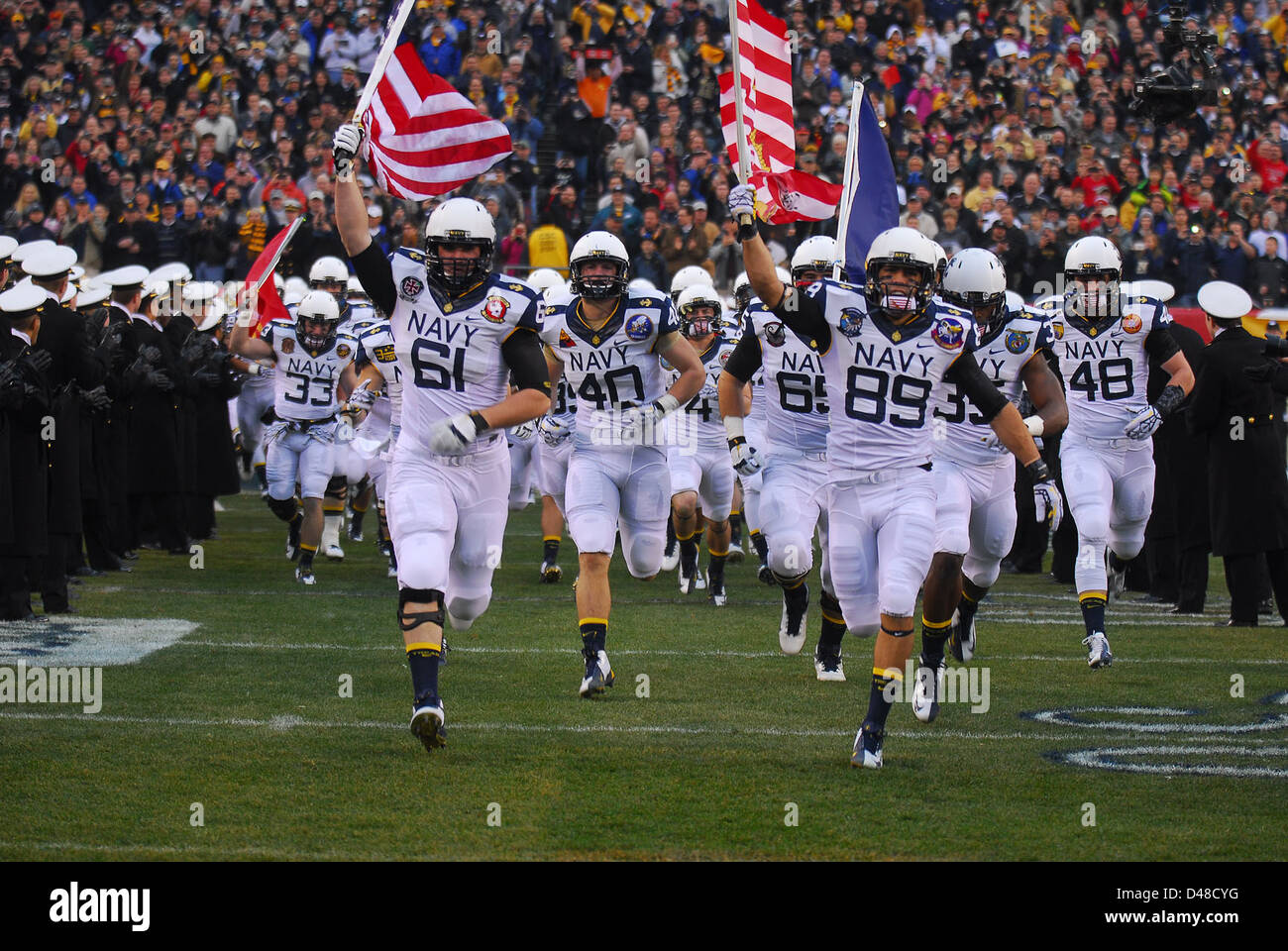 The Navy Midshipmen football team takes the field for a game in ...
