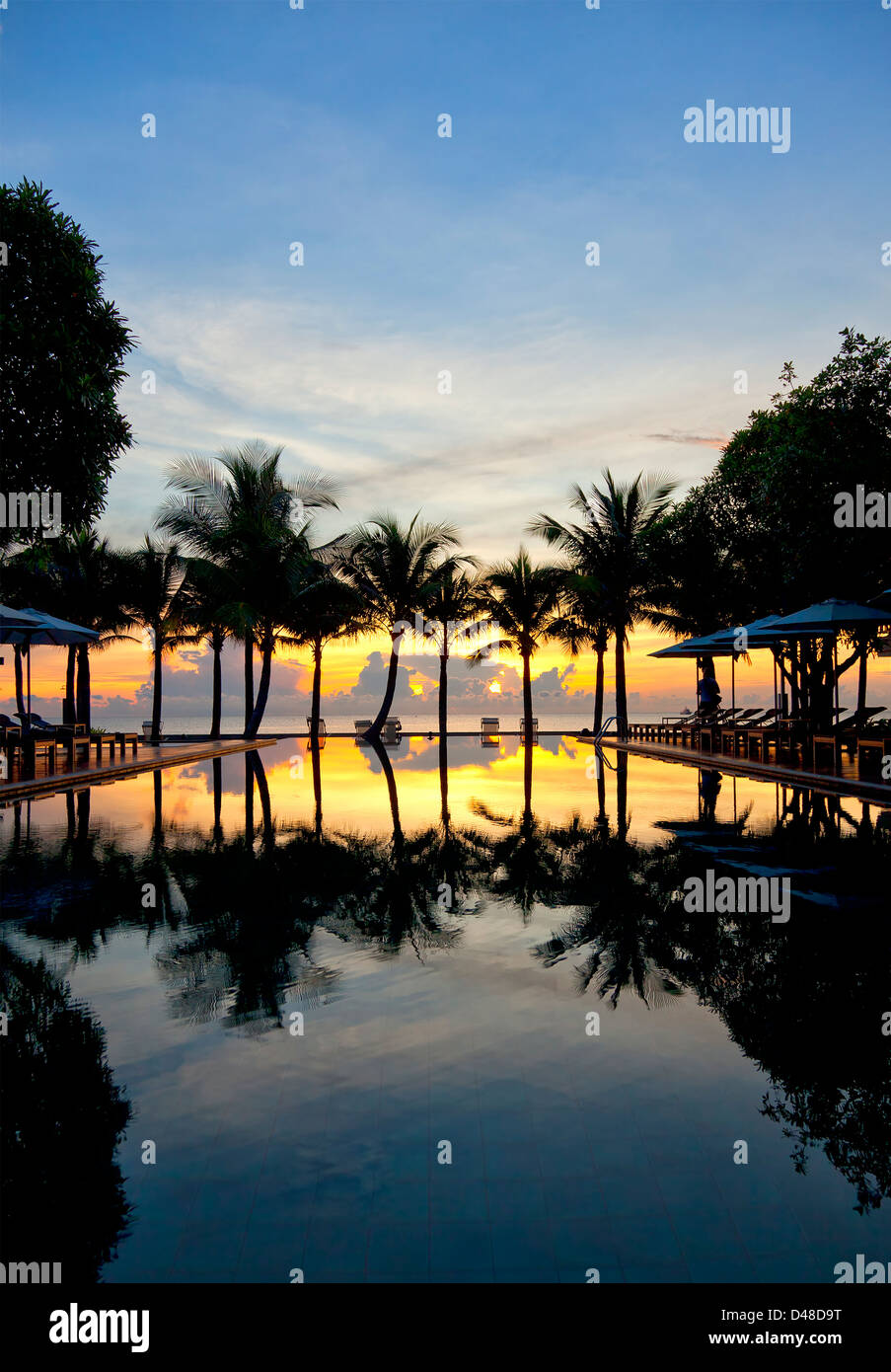 Beautiful sunrise by the infinity pool. Hua Hin, Thailand Stock Photo ...
