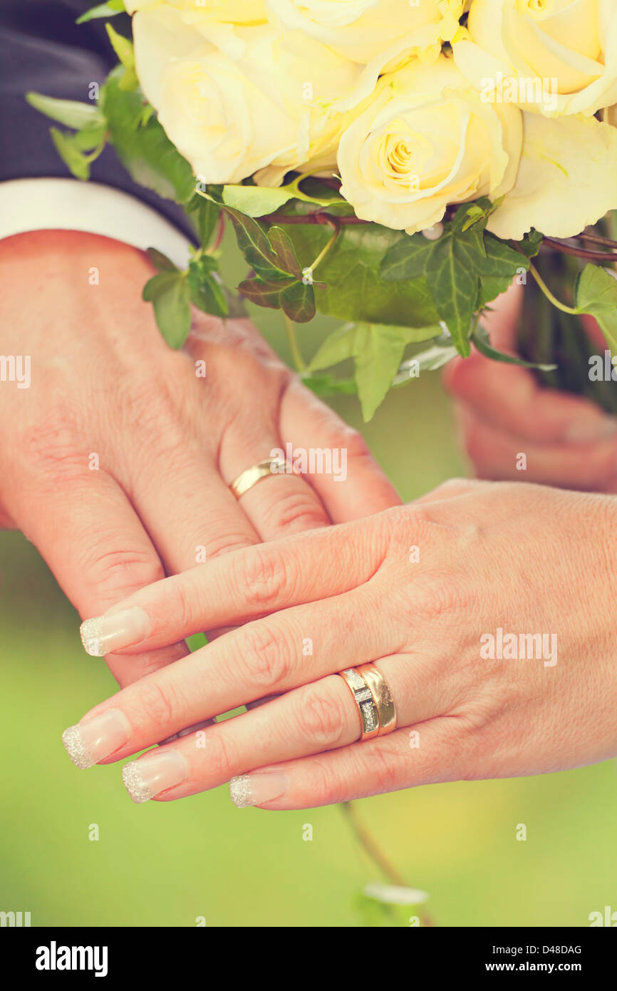 Wedding couple showing hands flowers hi-res stock photography and ...