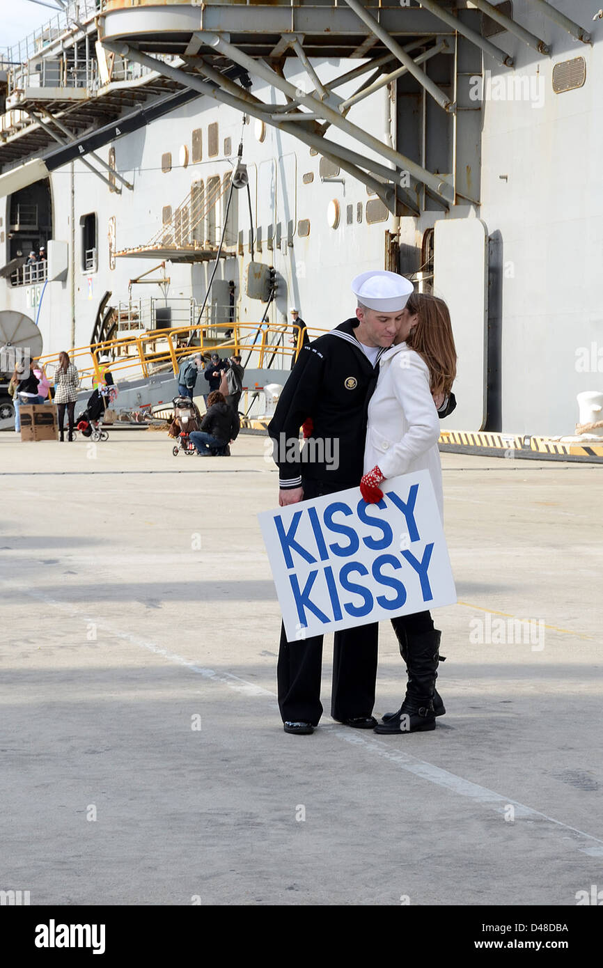A Sailor gets a kiss after deployment Stock Photo - Alamy