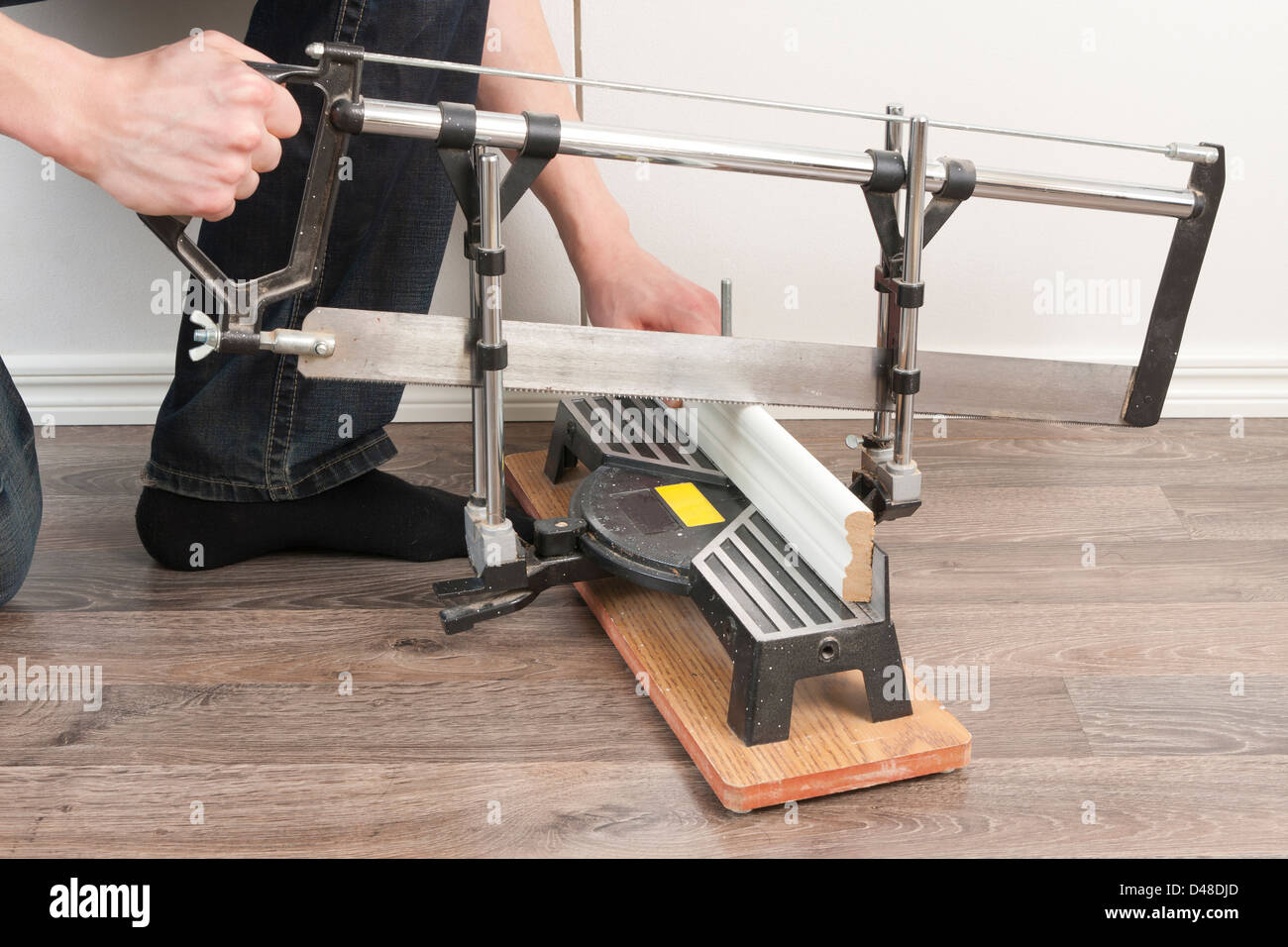 Worker Sawing Mopboard Stock Photo - Alamy