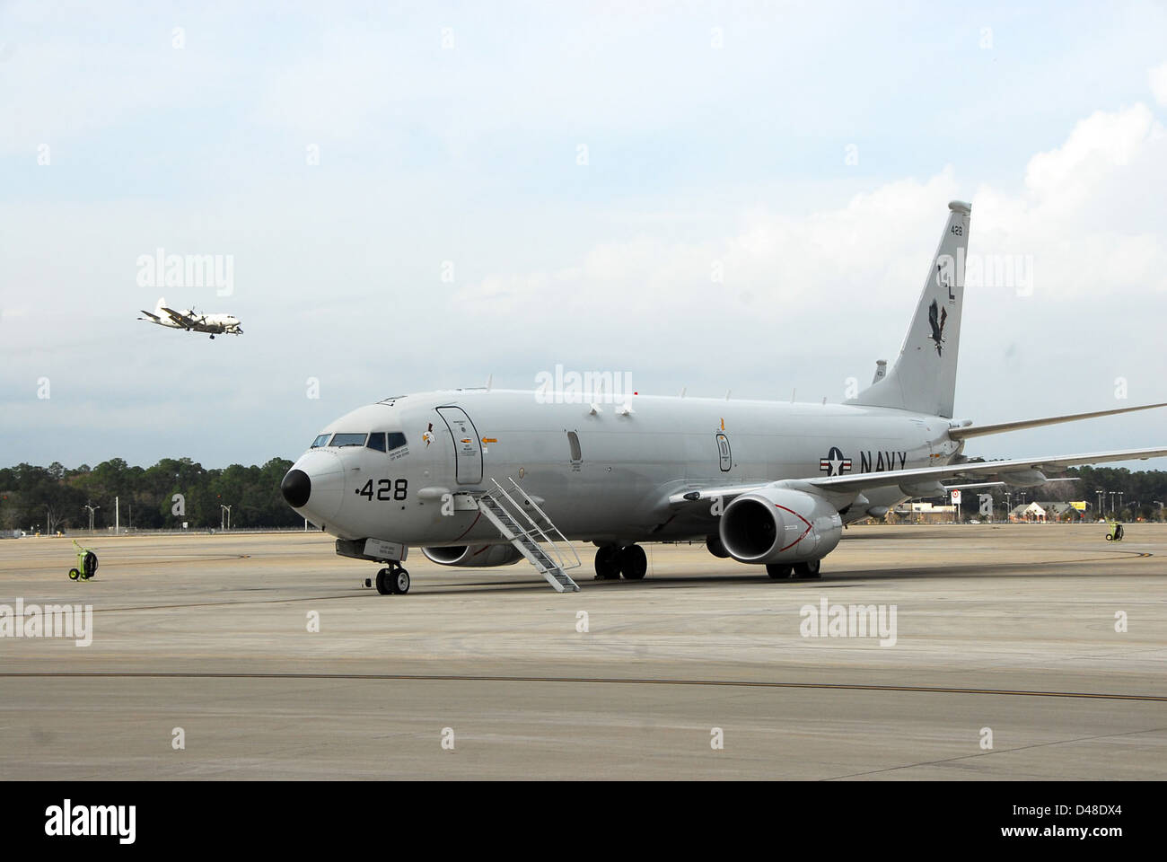 A P-8A Poseidon maritime patrol aircraft is stationed on the flight ...