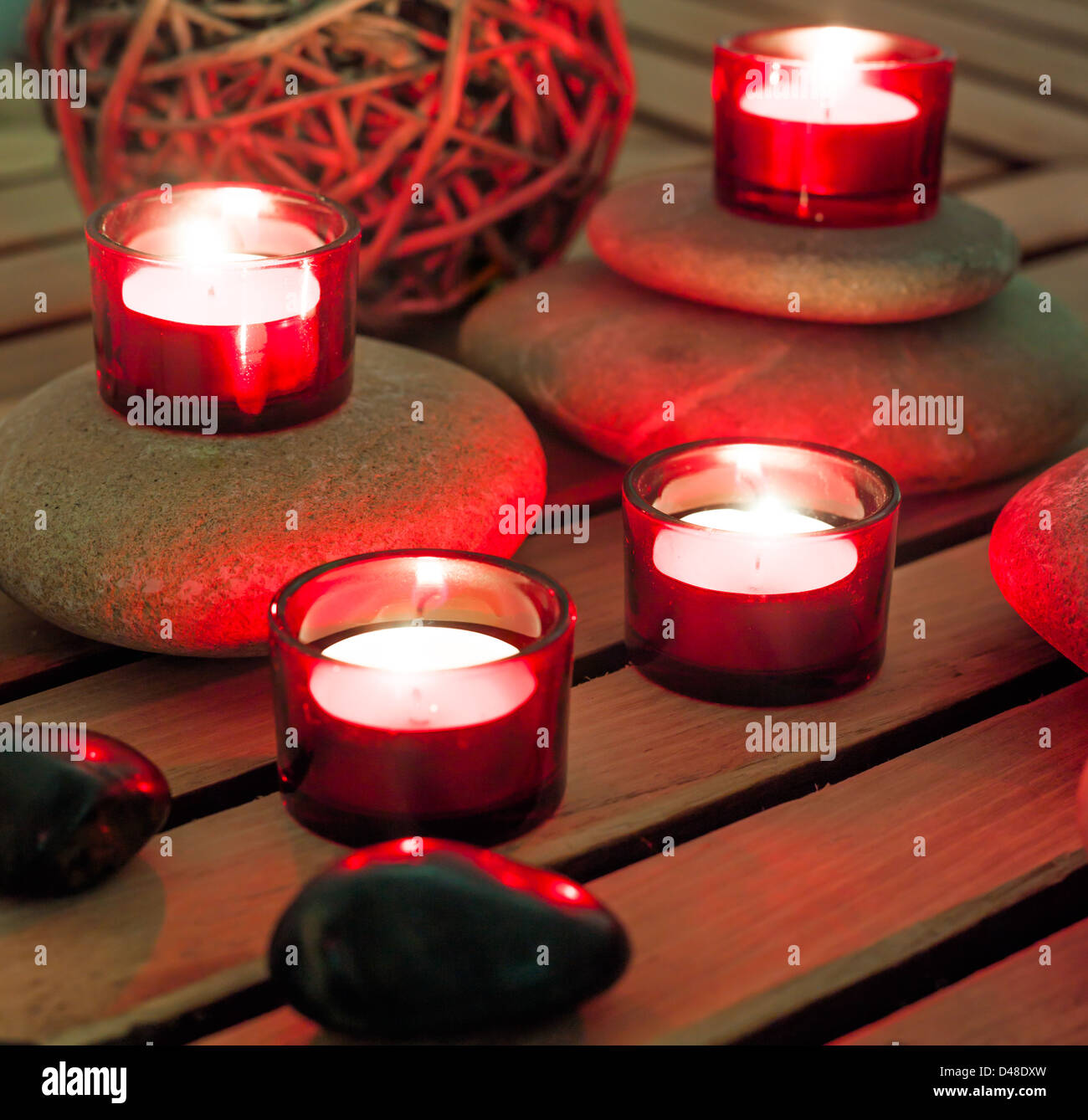 stone massage in soothing light Stock Photo - Alamy