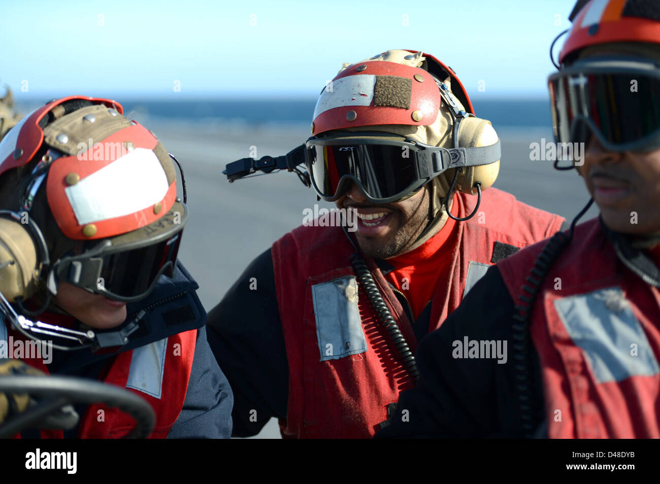 Sailors take a break from flight operations aboard the USS George H.W ...