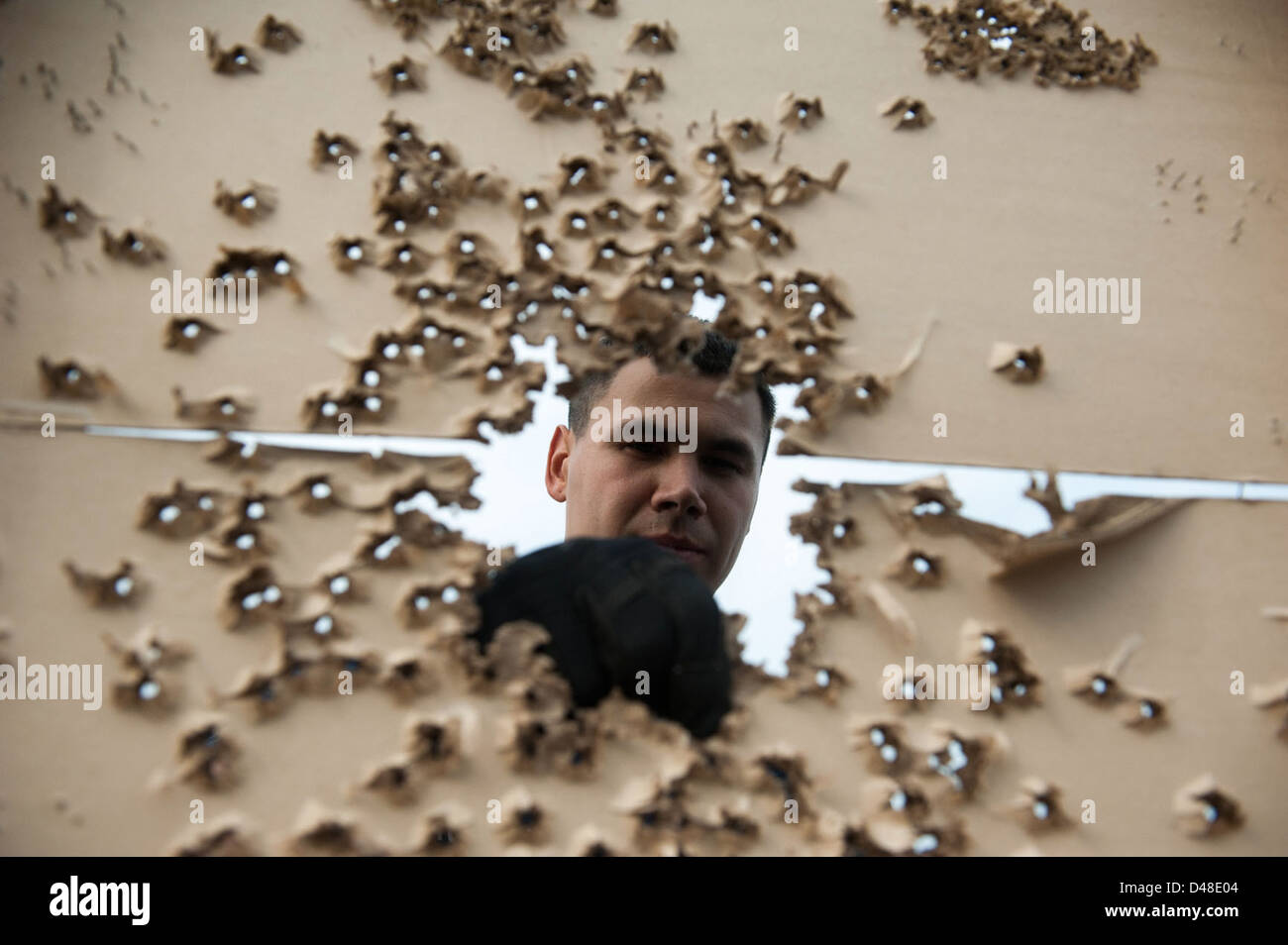 Sailor clears a firing range target at sea Stock Photo - Alamy