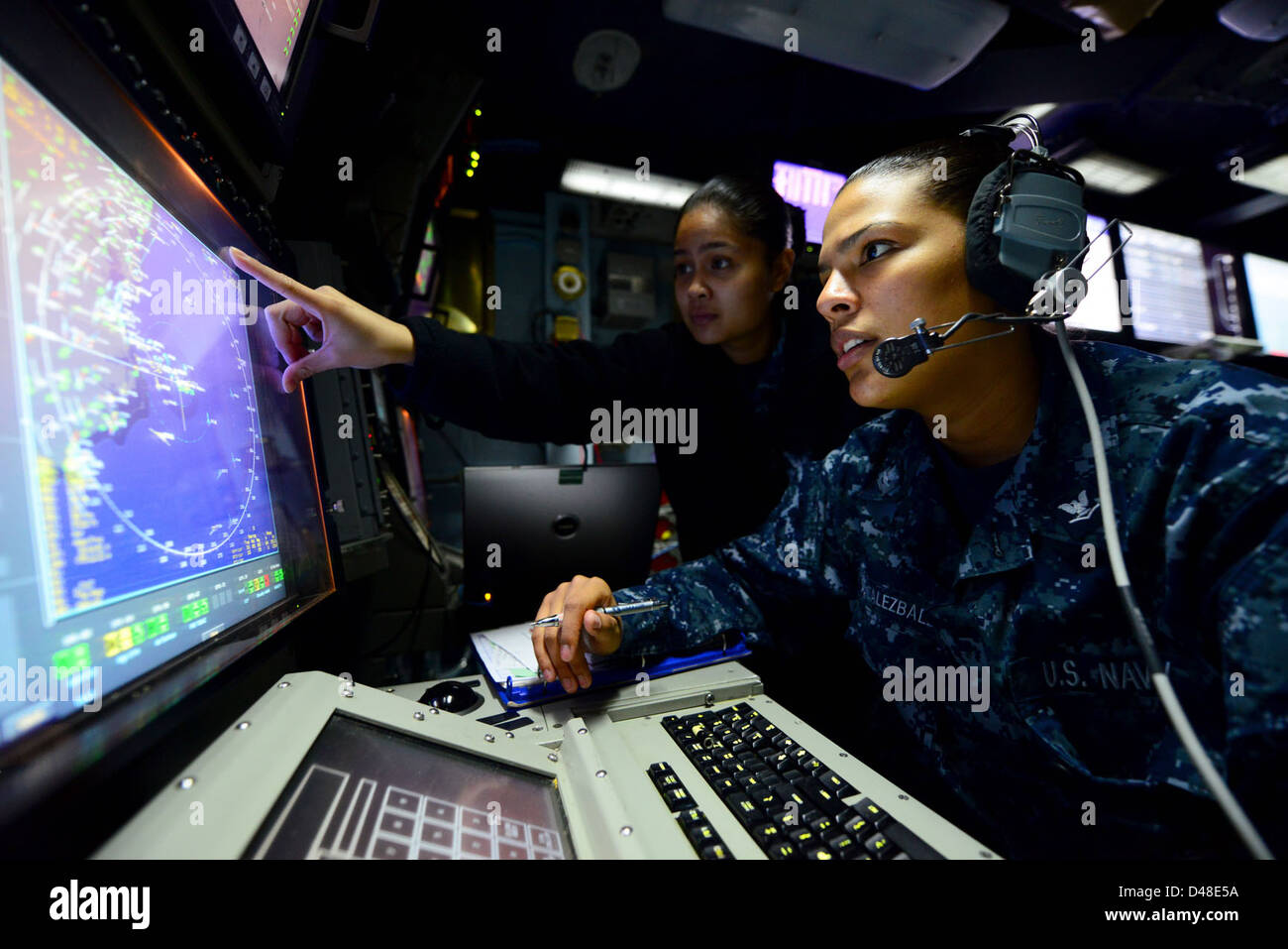 Sailors aboard a U.S. Navy ship conduct radar training at sea. The ...