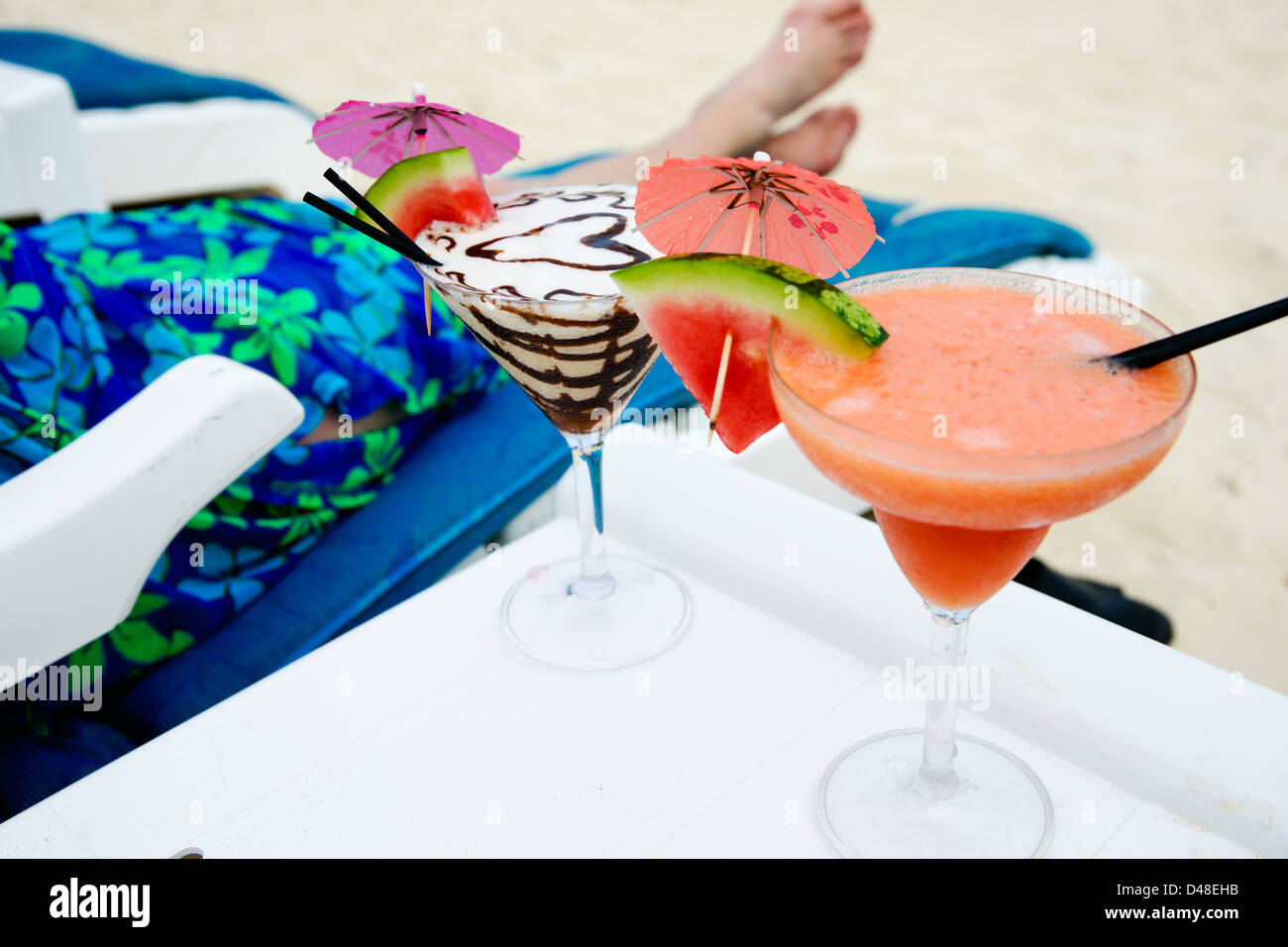 Relaxing by the beach with a cocktail Stock Photo - Alamy