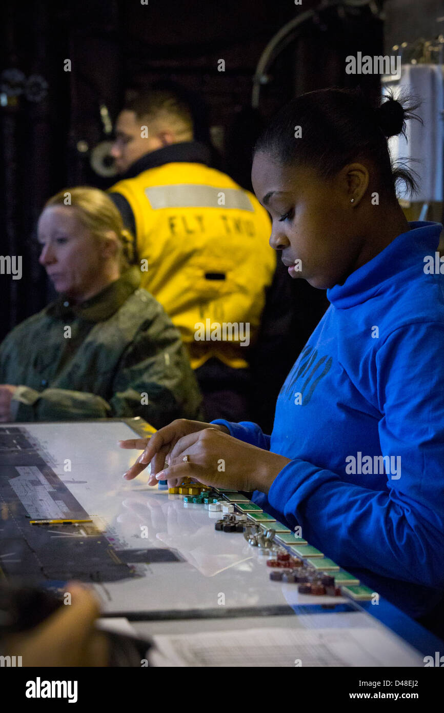 A Sailor monitors flight deck operations aboard a U.S. Navy aircraft ...