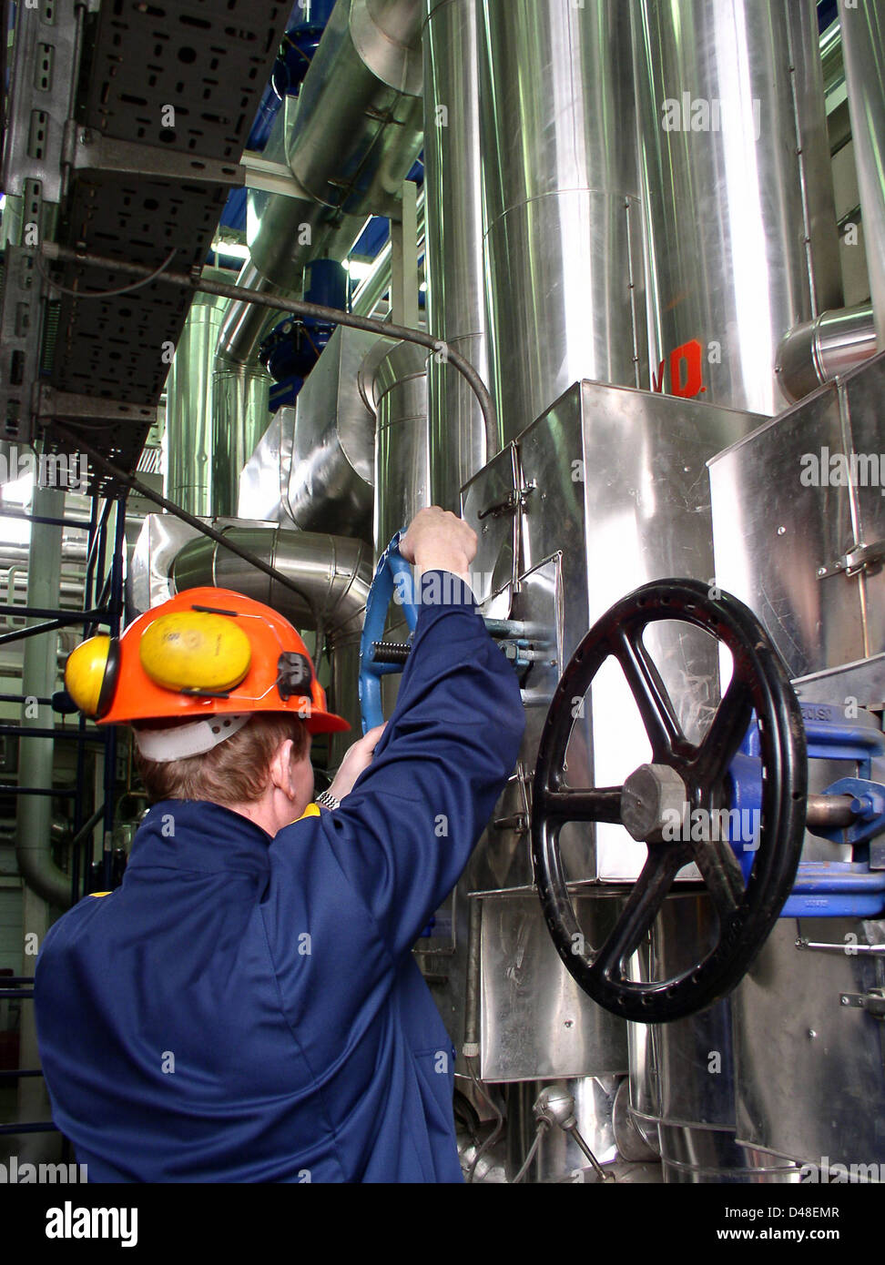 Engineer working in factory Stock Photo - Alamy
