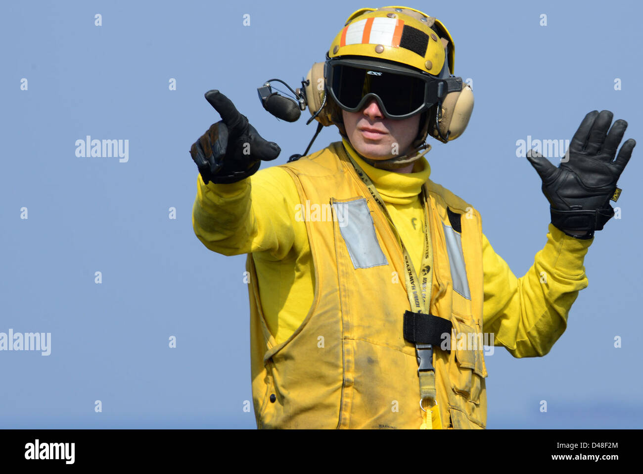 A Sailor directs aircraft operations aboard a U.S. Navy ship in the 5th ...
