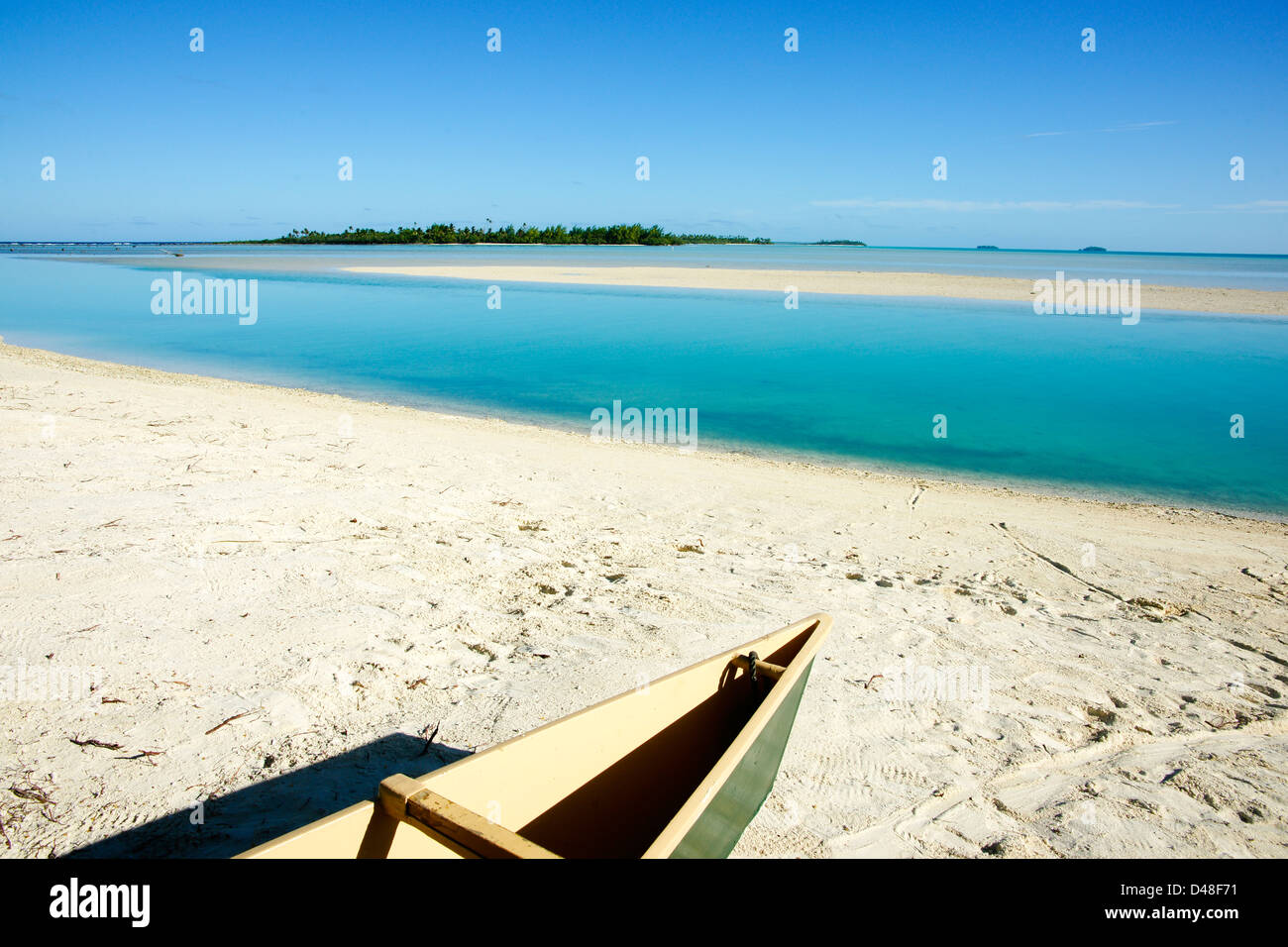 Cook Island beach with canoe on sand Stock Photo - Alamy