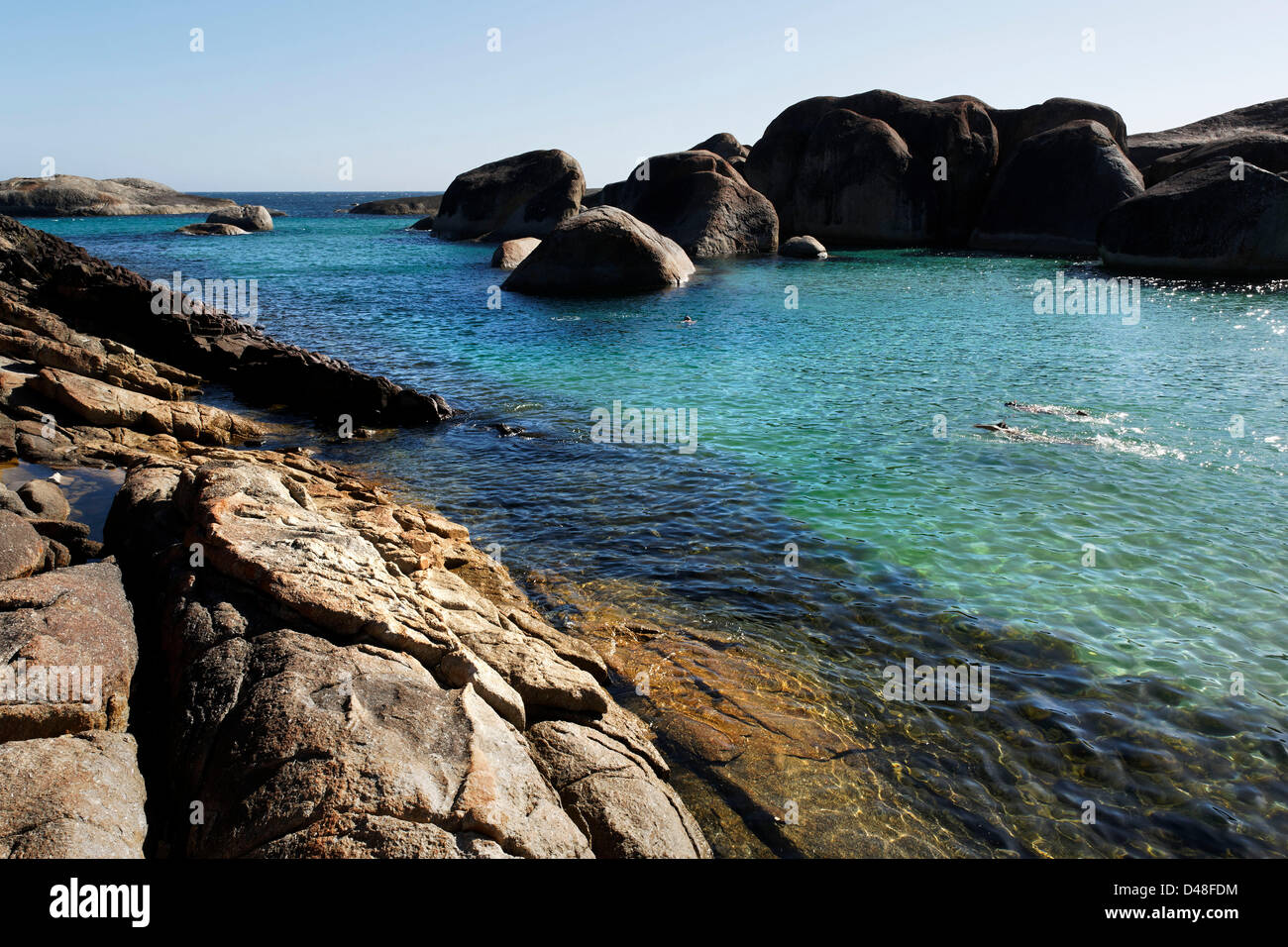 People snorkeling in water at Elephant Cove, Elephant Rocks near ...
