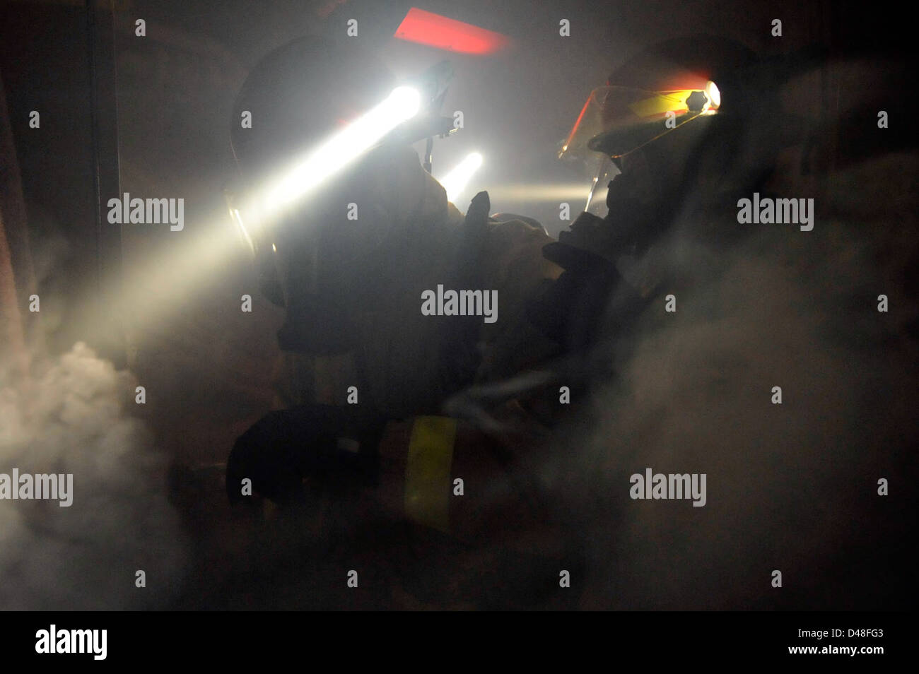 Sailors practice fire-fighting drills aboard a U.S. Navy ship deployed ...