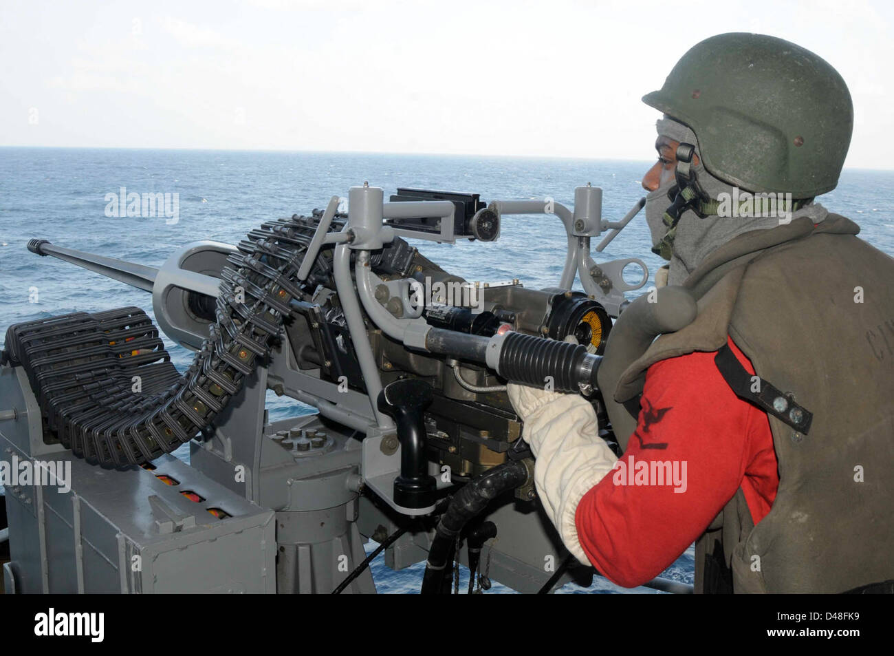 A Sailor mans a 25 mm machine gun during a drill Stock Photo - Alamy