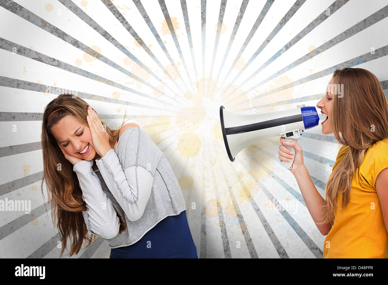 Girl shouting at her friend through megaphone Stock Photo - Alamy