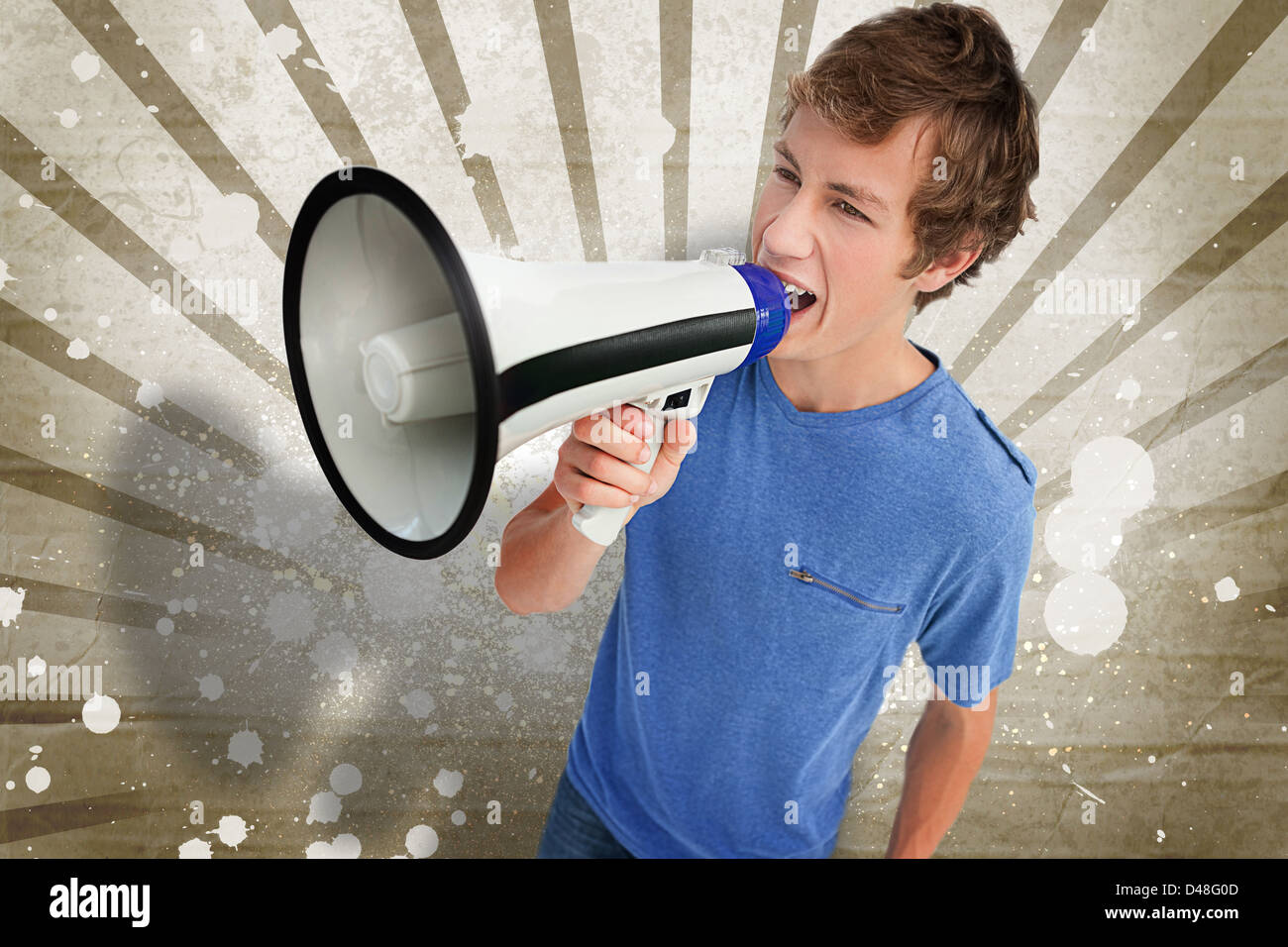 Young man shouting through a megaphone Stock Photo - Alamy