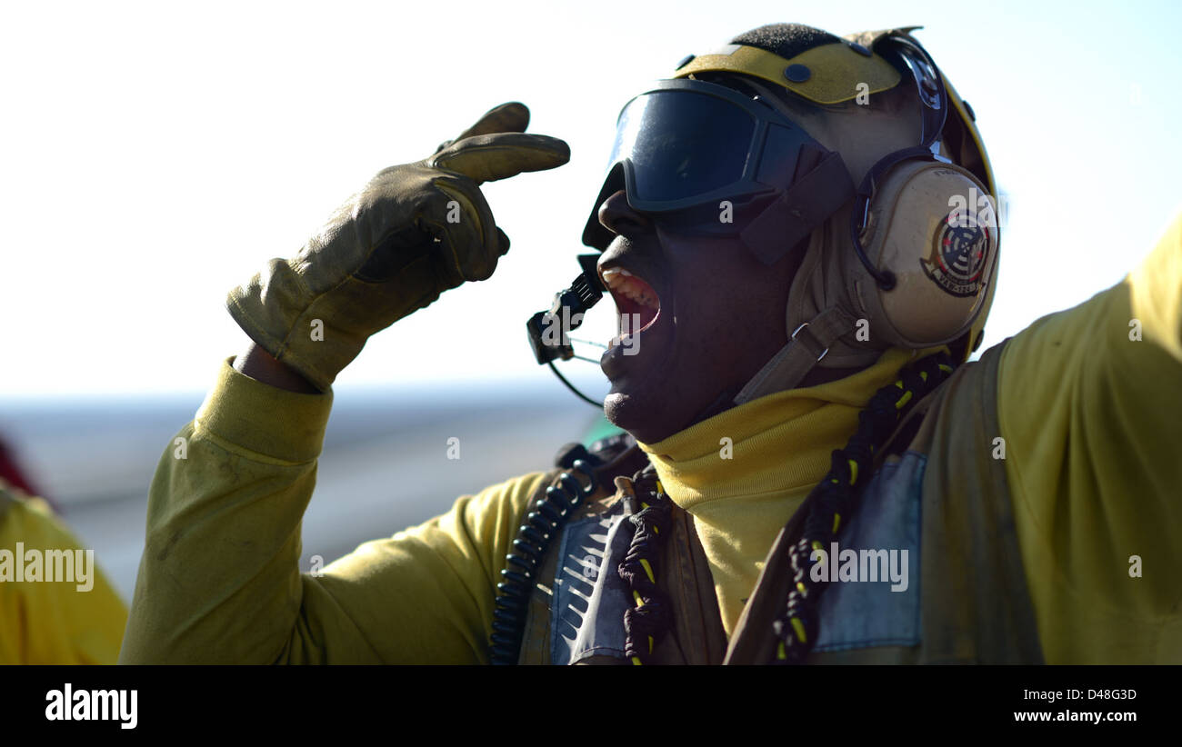 A Sailor oversees fire fighting training aboard a U.S. Navy vessel in ...