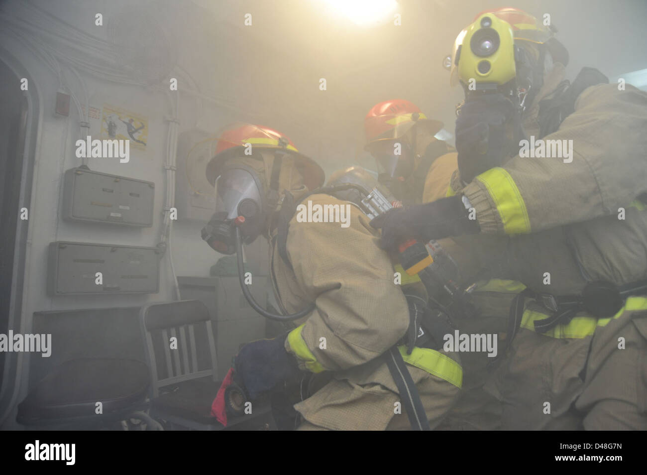 Us navy fire fighters hi-res stock photography and images - Alamy